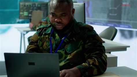 It Analyst In A High Tech Base Of Operations Handling Surveillance