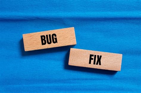 Premium Photo Bug Fix Words Written On Wooden Blocks With Blue Background Conceptual Bug Fix