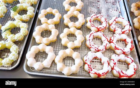 Assorted Mochi Donuts Displayed On Baking Trays Ready To Enjoy Stock