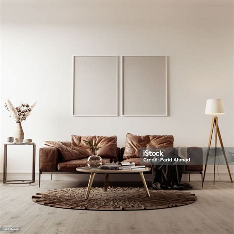 소파 램프 중앙 테이블이 있는 빈 방에 액자 인테리어가 놓여 있습니다 3d 렌더링 거품 소파가 있는 흰색 거실 인테리어 나무 바닥 큰 벽에 2개의 프레임 흰색 대지 가구에