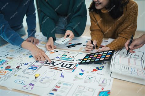 Premium Photo Asian Team Ux Developer And Ui Designer Brainstorming