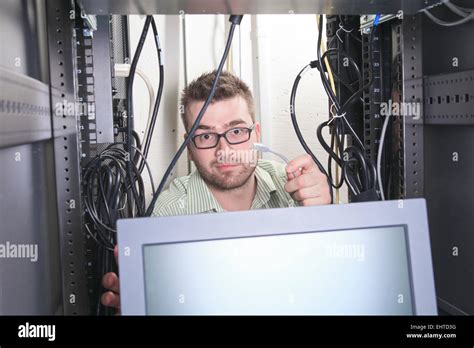 Network Engineer Working In Server Room Stock Photo Alamy