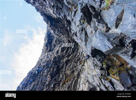 Towering Basalt Columns Create A Dramatic Backdrop At Reynisfjara Iceland The Rugged Cliffs Towering Basalt Columns Create A Dramatic Backdrop At Reynisfjara Iceland The Rugged Cliffs