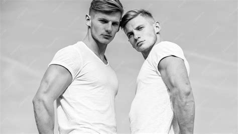 Premium Photo Men Twins Muscular Brothers Sky Background Handsome