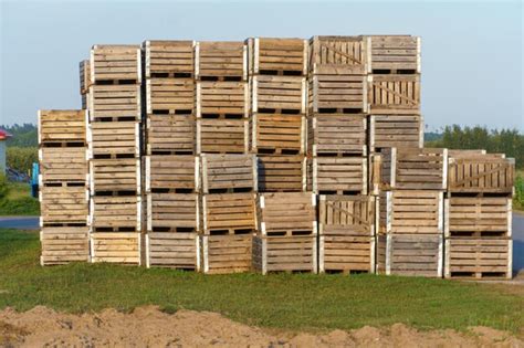 Premium Photo Rows Of Wooden Crates Crates And Pallets For Storing And Transporting Fruits And