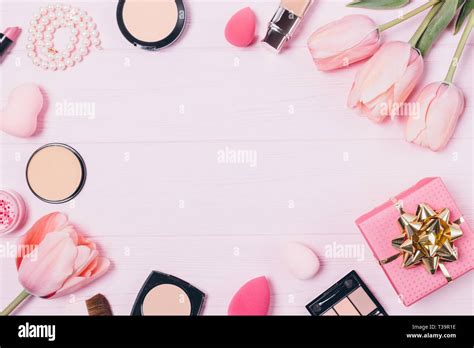 Beauty Products And Fresh Tulip Flowers On Pink Table Top View Flat Layout Of Decorative Women