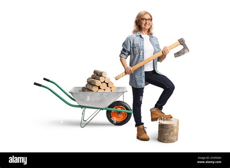 Woman With A Tree Trunk And A Wheelbarrow Holding An Axe For Wood Cutting Isolated On White