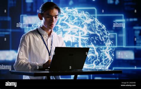 Admin Using Laptop To Visualize Artificial Intelligence Neural Networks