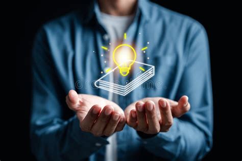Man Hand Holding Virtual Light Bulb And Book With Learning Educate