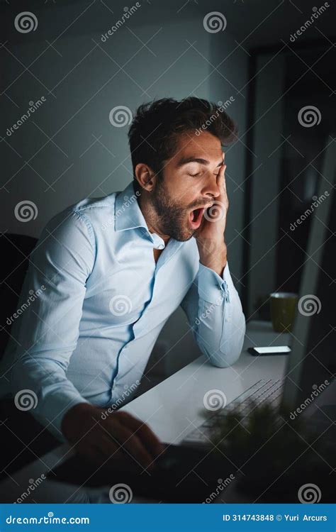 Man Tired And Yawning In Office With Computer For Coding Programming