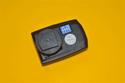 The Wireless Signalflash Trigger Positioned On A Vibrant Yellow