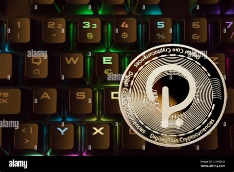 Digital Currency Lies On A Colourfully Illuminated Computer Keyboard