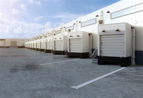 Premium Photo Warehouse Exterior With Shutter Doors And Truck Parking