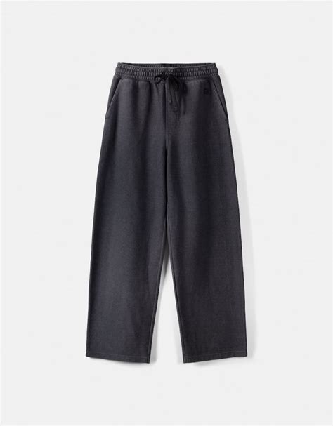 بنطال واسع الساقين مغسول بالأسيد وبتأثير باهت الرجل Bershka