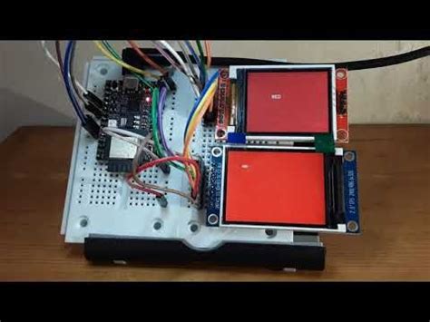 An Electronic Device With Many Wires Attached To It And Some Other Electronics On The Board