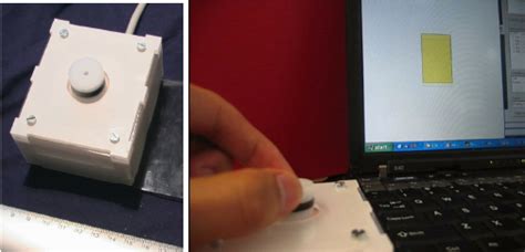 Prototype Controller Left Manipulating A Virtual Cube On A Laptop Download Scientific Diagram