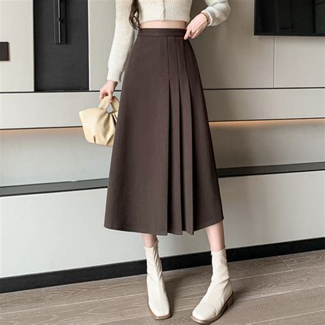 티몬 글로벌 홀세일 롱 치마불규칙 플리츠 스커트 2023 가을겨울 신상 하이웨이스트 A자 한국판 백합 심플한 통근스커트 Ol 여성의류