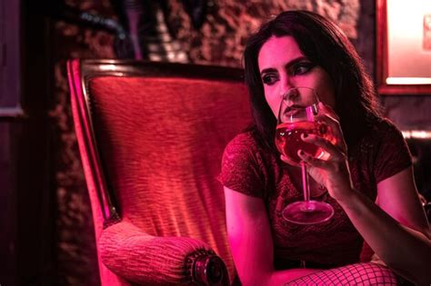 Premium Photo Depressed Brunette Rebel Girl Holding Drink In Elegant