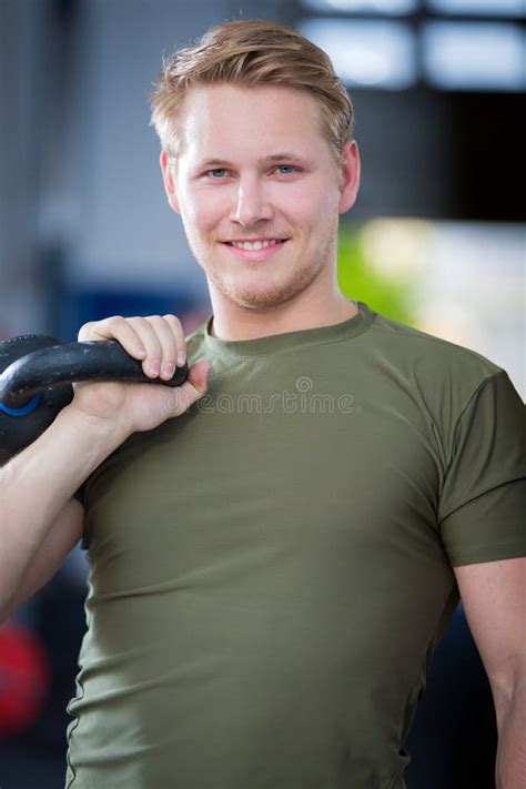 Man Holding Kettlebell At Crossfit Center Stock Image Image Of Muscle Athlete 41066033