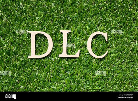 Wood Alphabet Letter In Word Dlc Abbreviation Of Downloadable Content On Artificial Green