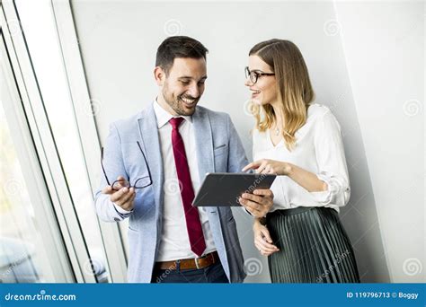 Businessman Presenting Business Data On Digital Tablet At Office Stock