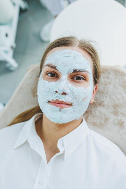 Premium Photo Smiling Face Of A Woman With A Moisturizing Mask On Her