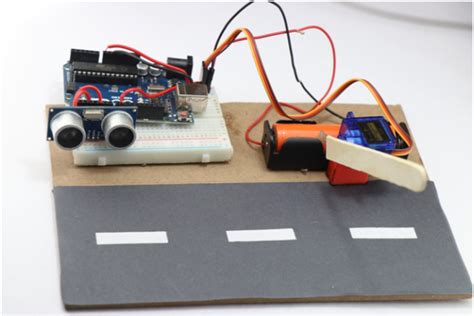 Toll Tax System Using Arduino Ultrasonic Sensor With Servo Motor
