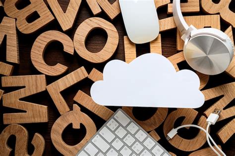 Premium Photo White Paper Cloud With Gadgets On The Background Of