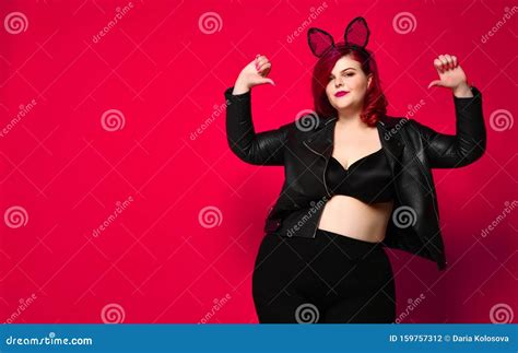 Cute Plus Size Brunette With Black Bunny Ears In Leather Jacket And