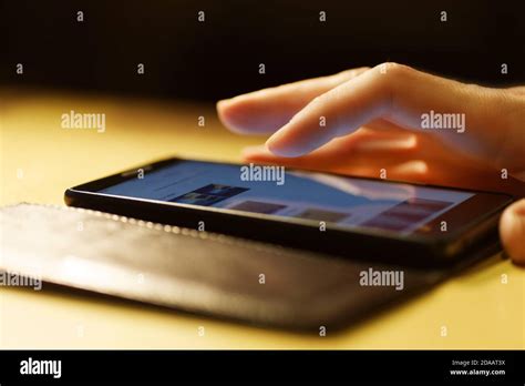 human hand using smartphone finger swipe up and down the screen of