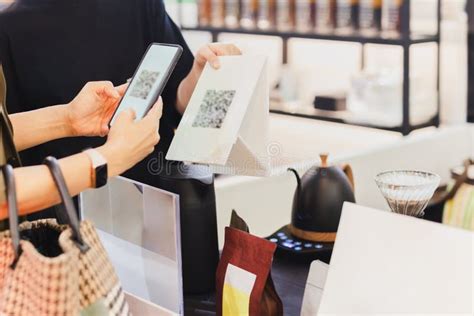 Women Customer Paying By Qr Code Scanning On Mobile Phone At Shop