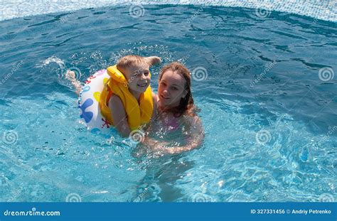 Brother And Sister Playing In The Pool Stock Photo Image Of Relaxation Girl