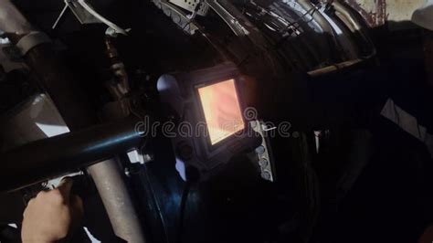 thermodynamics specialist conducts thermal imaging of a turbine engine