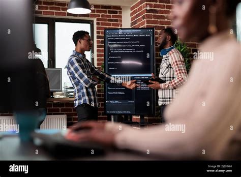African American Software Developer Pointing Out Cloud Database
