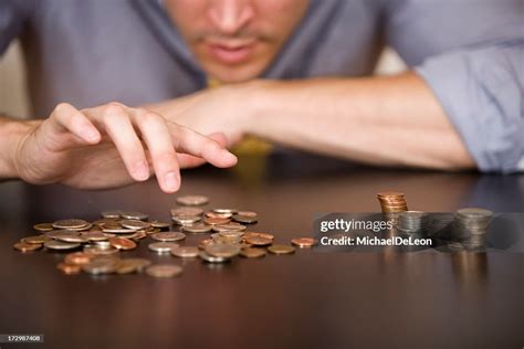 counting or sorting coins with 4 piles of different types high res