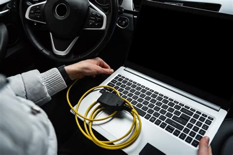 Premium Photo Human Making Car Diagnostics Using Obd Device And Computer