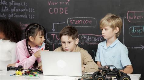 Boy Using Laptop Programing Engineering Code And Writing Program