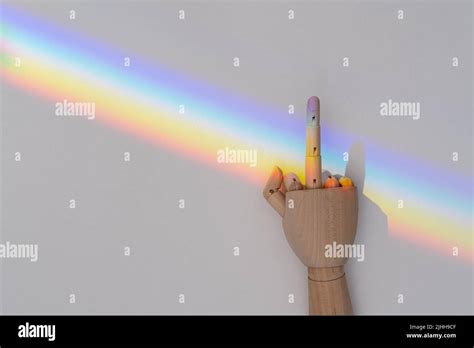 Wooden Hand Showing Fuck You Gesture On LGBT Community Rainbow Flag Stock Photo Alamy