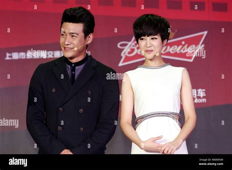 Chinese Actor Lu Yi Left And His Actress Wife Bao Lei Smile During The Premiere Of The Micro