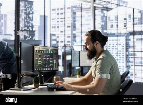 Data Scientist At Pc Desk Developing Algorithms That Enable Machines To Learn From Data Man In