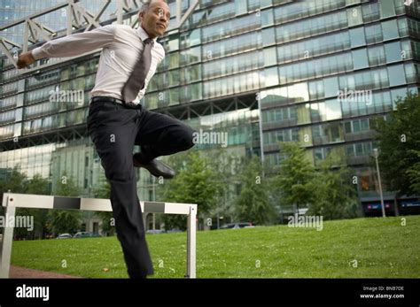 Man Jumping Hurdle High Resolution Stock Photography And Images Alamy