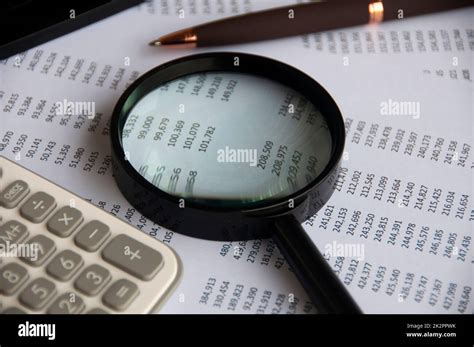 Business Analysis Concept Magnifying Glass With Pen Calculator And