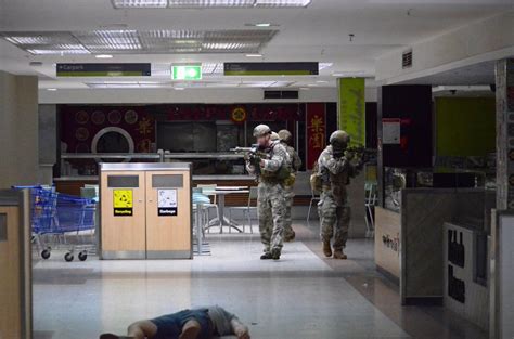 members of the territory response group interrupt a man enjoying a