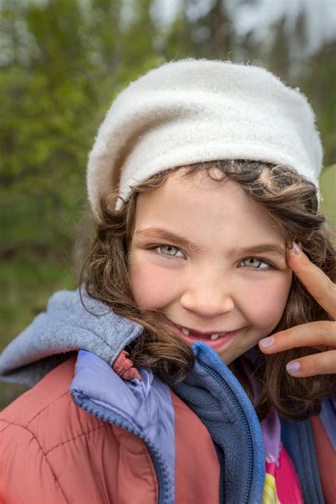 Outdoor Portrait Of Cute Smiling Young Girl With Gap Teeth Stock Image