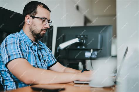 Premium Photo Portrait Professional Man Programmer Working Concentrated On Computer In Diverse
