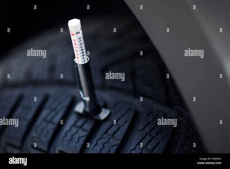 Taking Tyre Tread Depth Gauge Readings Stock Photo Alamy