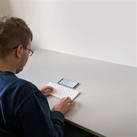 top user typing with our mixed reality apparatus bottom the mixed