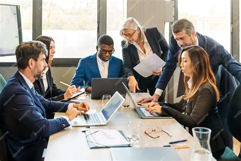 Premium Photo Group Of Diverse Colleagues Collaborating On Project In Conference Room