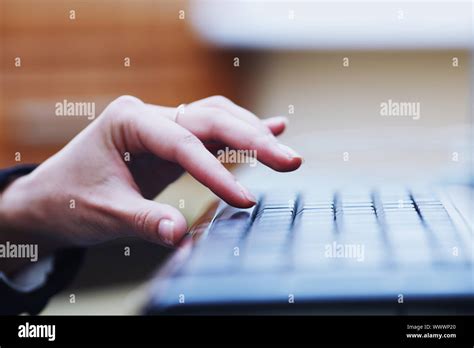 Human Hand Going To Press Key On Keyboard Stock Photo Alamy