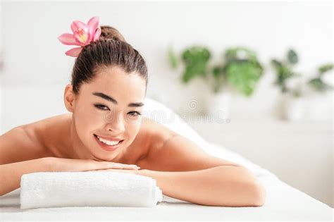 Beautiful Asian Woman Lying On Table In Spa Salon Waiting For Massage Stock Image Image Of